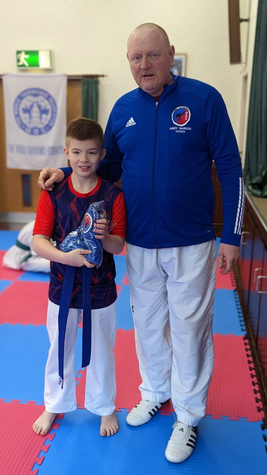 Jacob being promoted – AMC Taekwondo